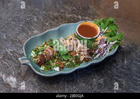 Deep fried horseface loach fish fried or Crispy fried Banana-root ...