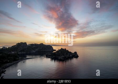 Sunrise over Isola Bella island near Taormina, Sicily, Italy Stock ...