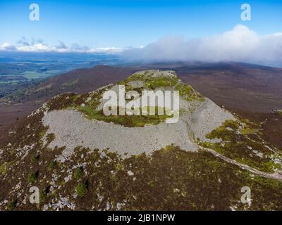 Aerial photograph of the distinctive granite plug and hillfort remains ...