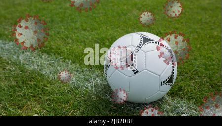 Covid-19 cells against soccer ball on sports field Stock Photo - Alamy