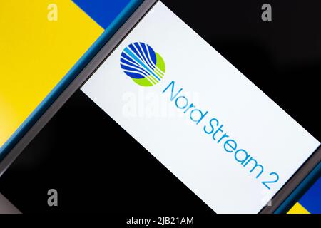Nord Stream 2 logo on iPhone on Ukrainian flag. Nord Stream is offshore ...