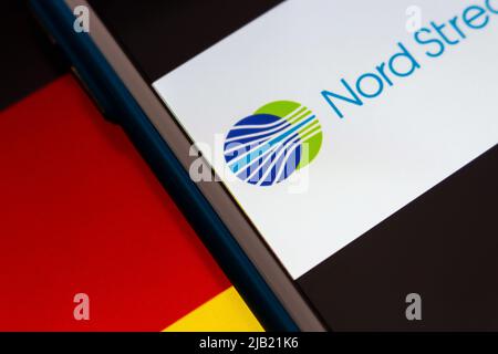 Nord Stream 2 logo on iPhone on German flag. Nord Stream is offshore ...