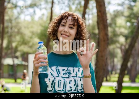 Young redhead woman doing ok gesture shocked with surprised face, eye ...
