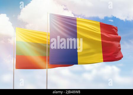 Lithuania flag and Romania flag waving together on blue sky, two ...