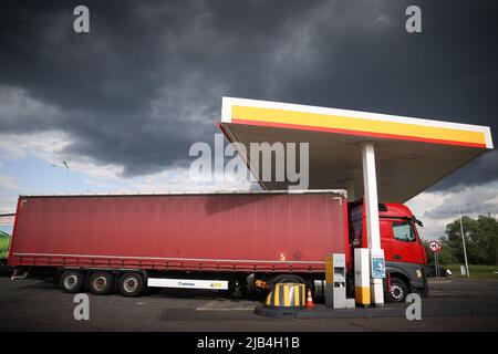 A view of Shell gas station with a cloudy sky in the background. (Photo ...