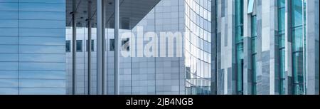 facades of modern high-rise concrete and glass buildings in the city of ...