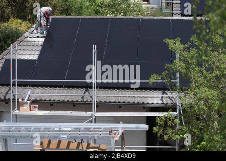 Installation of photovoltaic panels on a garage roof, Bavaria, Germany ...