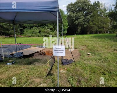 Sign warning of uneven ground Stock Photo - Alamy