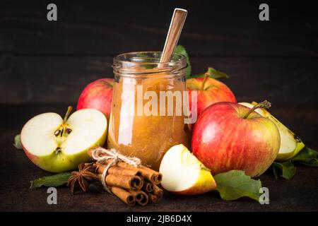 Apple jam with spices and fresh apples on dark background Stock Photo ...