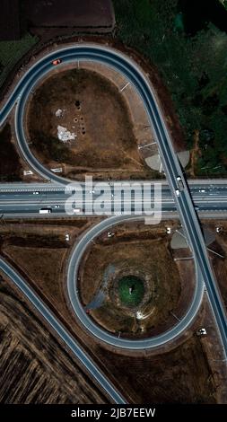 Drone photography of multiple lane road going to ring intersection in a ...