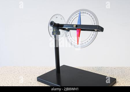 3d illustration of magnetic field. Compass with needle pointing south ...