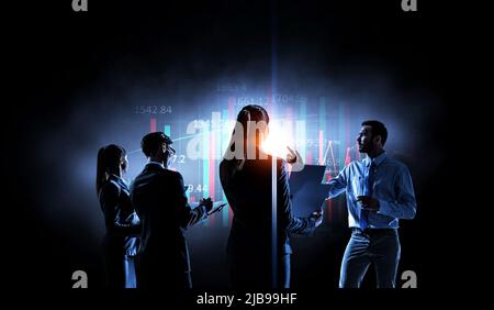 Group of business people outlines with lit background Stock Photo - Alamy
