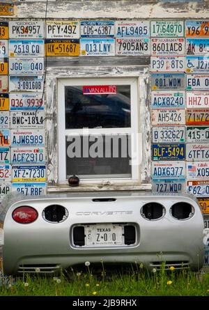 car license plates from different states and a corvette car rear end ...