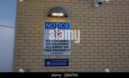 No Firearms warning sign on a VA Clinic entrance Stock Photo - Alamy