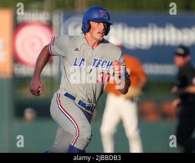 Louisiana Tech outfielder Steele Netterville (30) walks to first ...