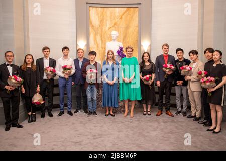 Queen Mathilde of Belgium (C) and winner Hayoung Choi (R) meet after ...