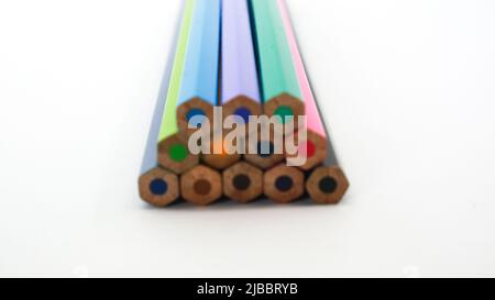 Stack of colorful pencils tips on dark table, art background. Set for ...
