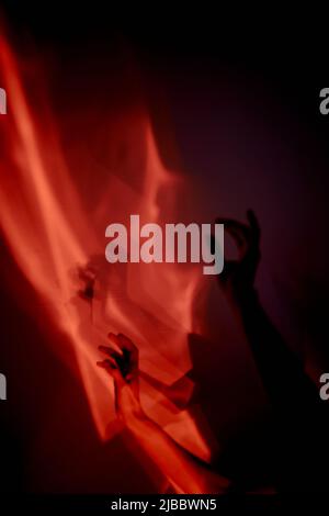 Hands in red light. Abstraction. Shadow theatre, hallucinations Stock ...