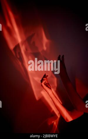 Hands in red light. Abstraction. Shadow theatre, hallucinations Stock ...