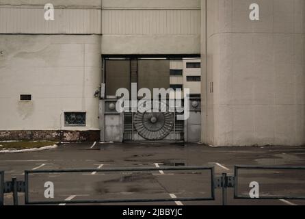 factory steel gray research institute door in a concrete opening utumn ...