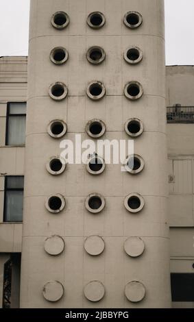 research institute concrete factory wall with holes and tunnel autumn ...