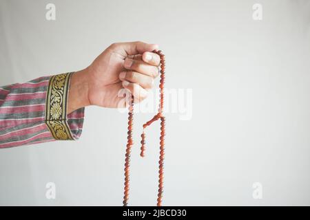 muslim man keep hand in praying gestures during ramadan, Close up Stock ...