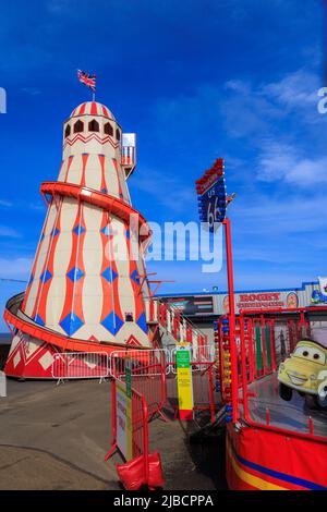 The fun fair at Hunstanton on the north coast of Norfolk on a clear ...