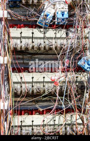 Mess in a telephone junction box Stock Photo - Alamy