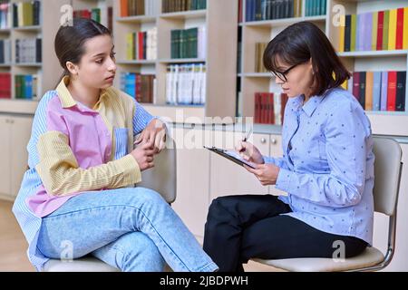 Psychologist, high school behavior counseling teenage student in ...