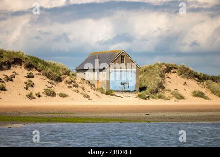 An abandoned fishermans cottage on the beach at Catterline ...