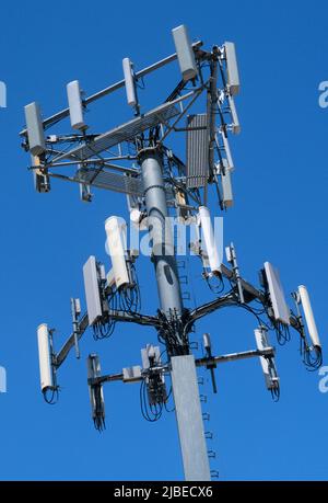 Cell phone cellular transmission tower blue sky Stock Photo - Alamy