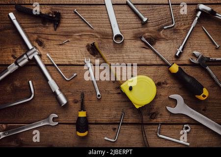 A top view of various tools for repairing on a wooden table Stock Photo ...