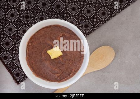 Traditional African Sorghum breakfast porridge or Mabele, on mottled ...