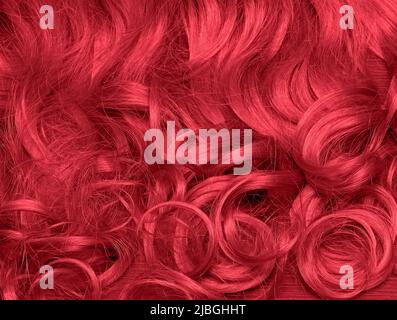 Fiery red female dyed hair with curly waves texture background Stock ...