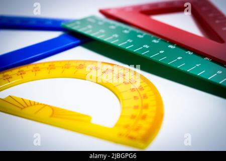 Concept image of colourful rulers and protractor in white background ...