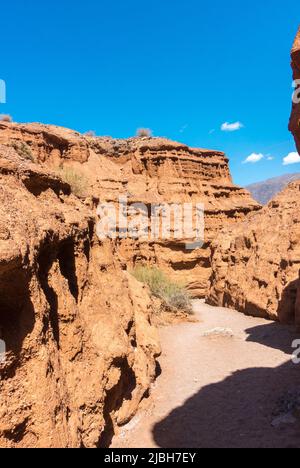 Red rocks and a passage between rocks. Clay canyons. Issyk-Kul region ...