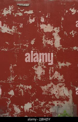 Red and burgundy colored wall texture with rough surface, two color ...