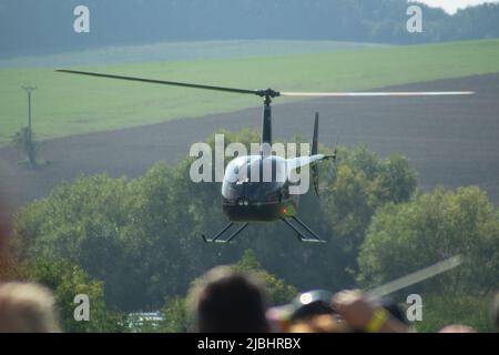 Black Robinson R44 helicopter at Boleradice Stock Photo - Alamy