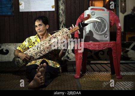 Sapeh, or Sape, a traditional Dayak string instrument of Borneo origin ...