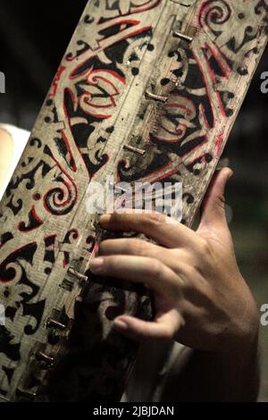 Sapeh, or Sape, a traditional Dayak string instrument of Borneo origin ...
