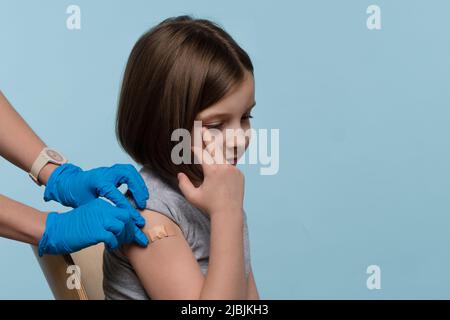 girl is crying afraid of the injection vaccination. Fear of injections ...