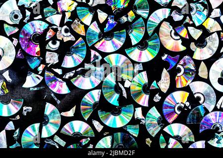 Creative background made of broken CD and DVD data discs Stock Photo ...