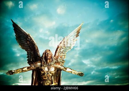 angel statue with open arms and divine light Stock Photo - Alamy