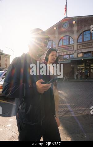 Seattle, USA. 21 May, 2022. Stylish women reflected in a mirror on 3rd ...
