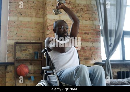 Young Man in Wheelchair Training on Outdoor Running Track Showing ...