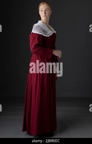 A working class Regency woman wearing a red dress Stock Photo - Alamy