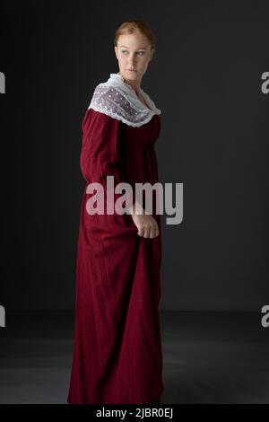 A working class Regency woman wearing a red dress Stock Photo - Alamy