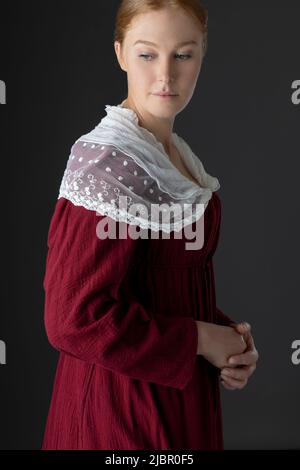 A working class Regency woman wearing a red dress Stock Photo - Alamy