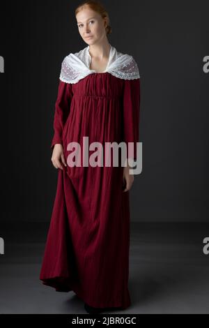 A working class Regency woman wearing a red dress Stock Photo - Alamy