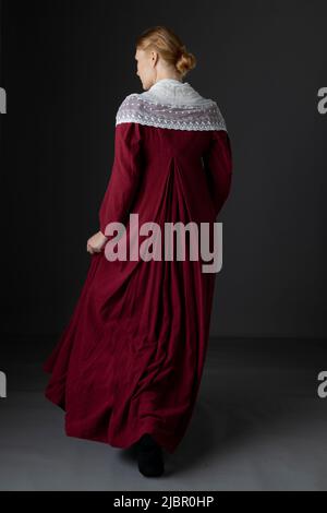 A working class Regency woman wearing a red dress Stock Photo - Alamy
